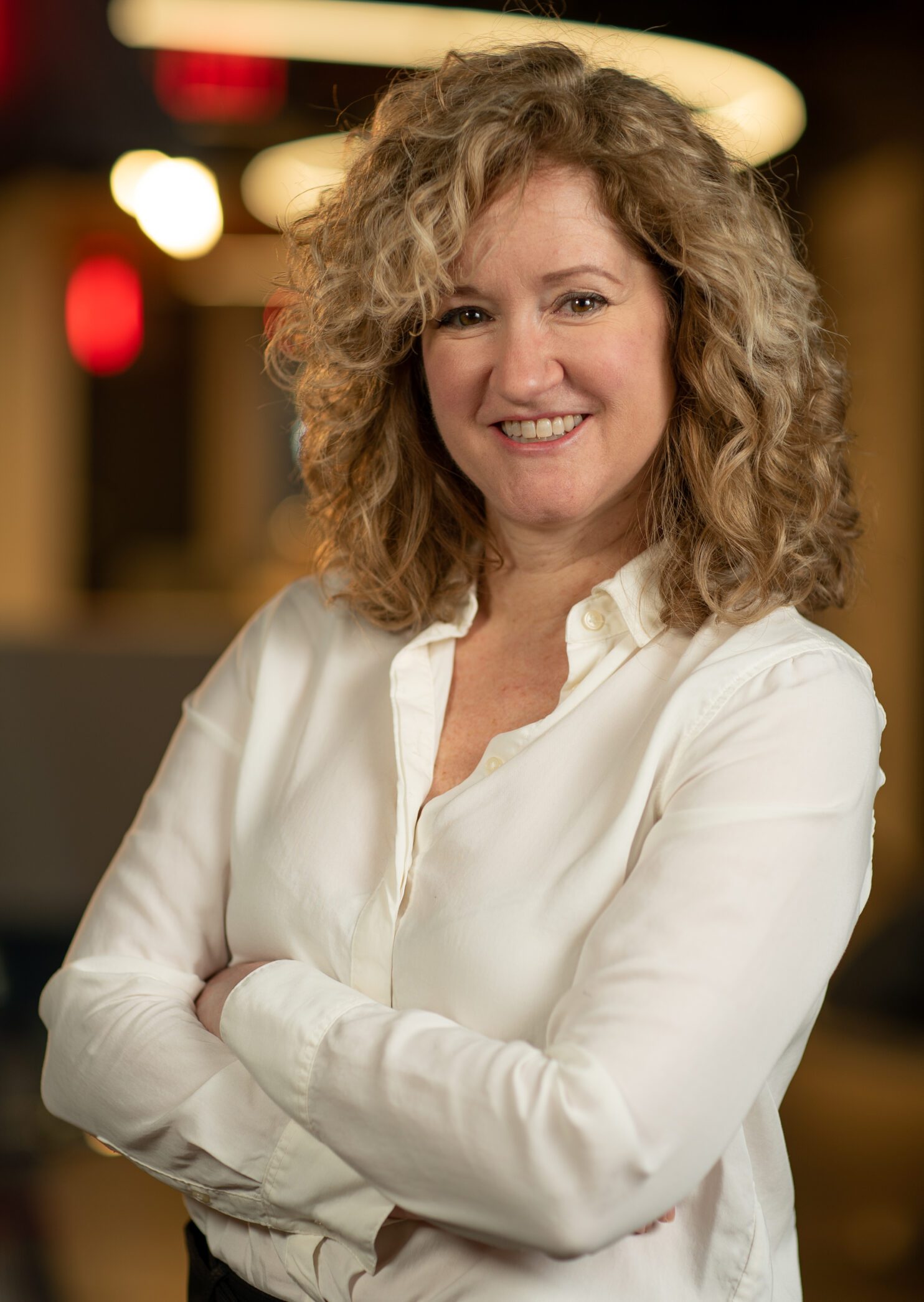 Headshot_Denise Naughton_crossed arms | Stars Design Group